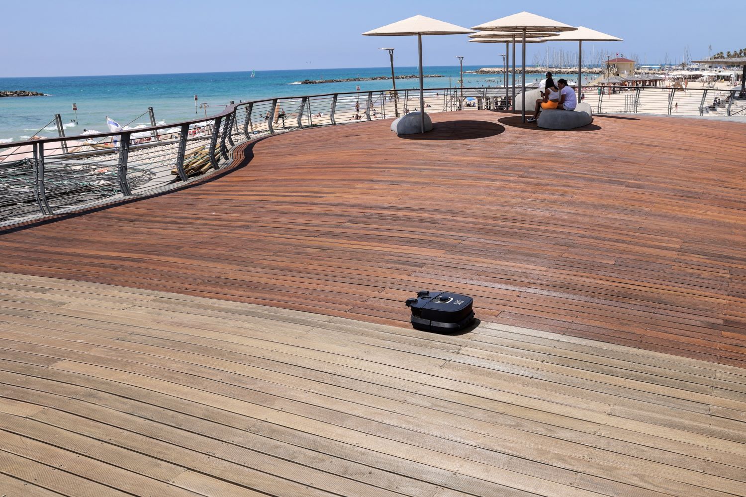 Little Robot Cleaner Keeps Outdoor Decking Shipshape